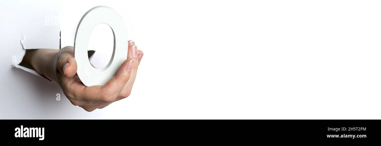 Female hand holding a number zero white isolated background. Copy Space ...