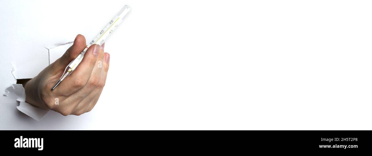 Hand with thermometer on white background isolated. Copy Space Stock ...