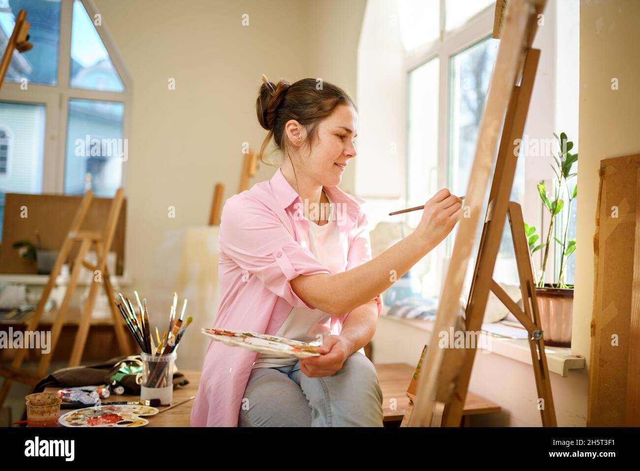 Art, creativity, hobby and creative occupation concept. Bringing ...