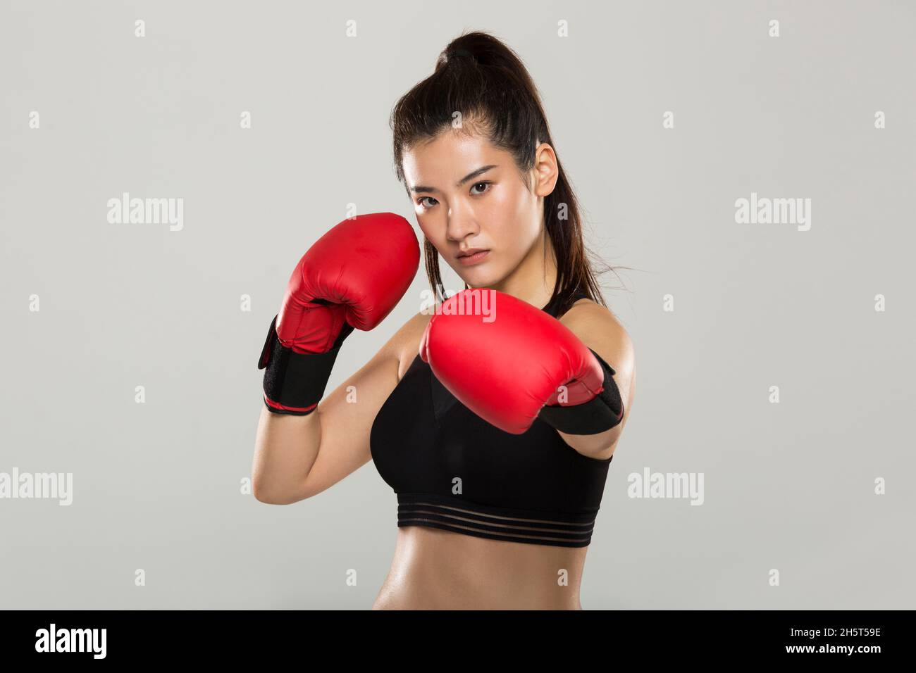 Young woman boxer standing punching hi-res stock photography and images ...