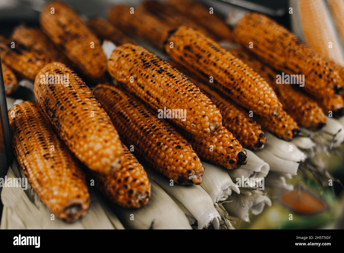 Bright orange grilled corn. A quick outdoor healthy snack Stock Photo ...