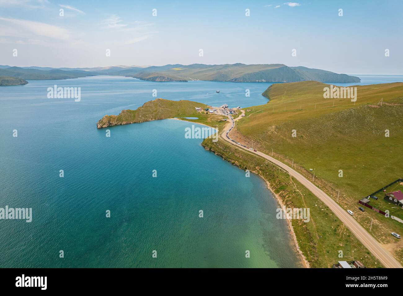 A ferry from the east coast to Olkhon Island Khuzhir at sunrise. Lake ...