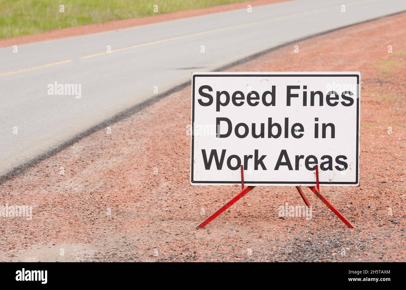 Speed fines double in the work area sign Stock Photo - Alamy