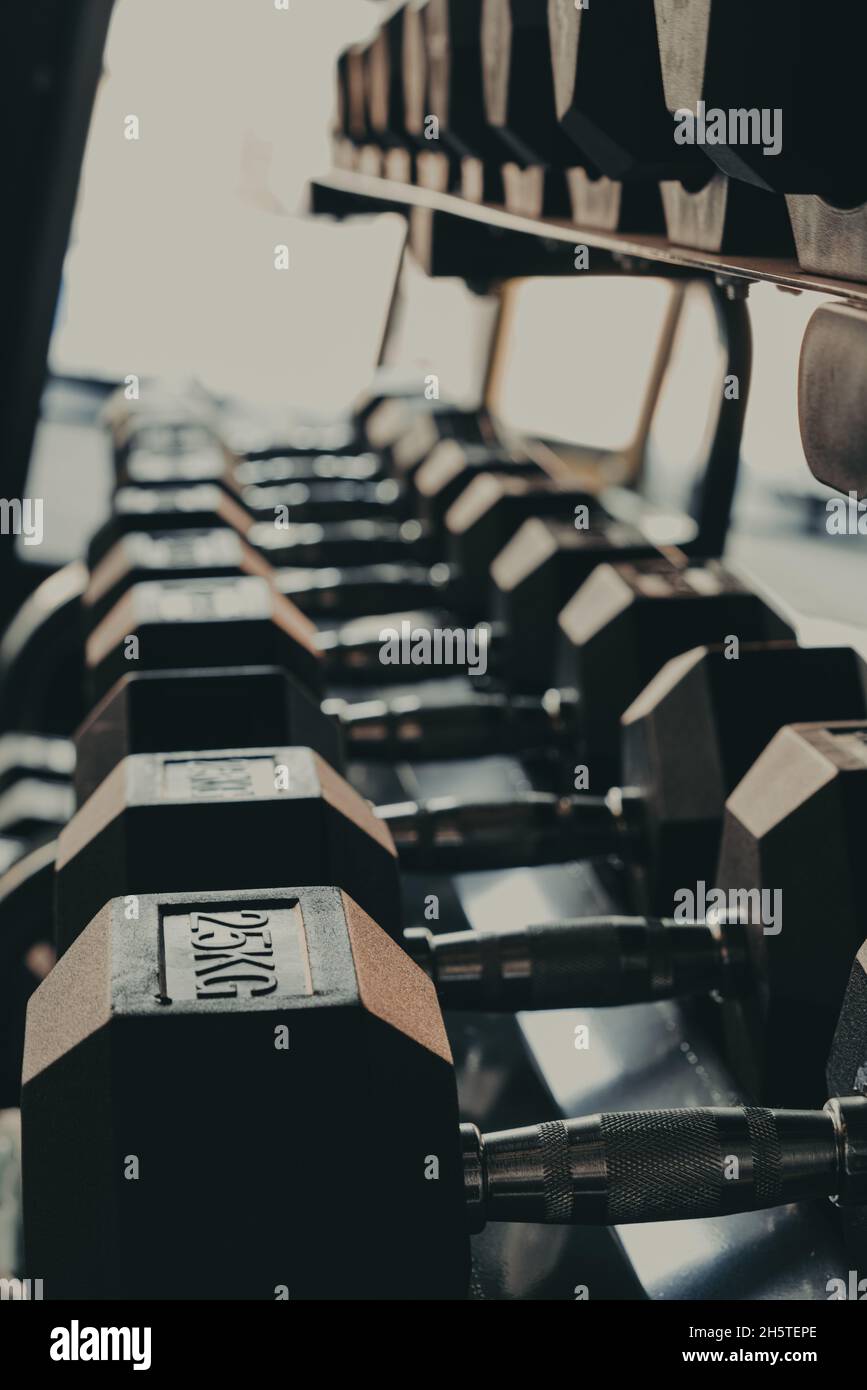 dumbbell on the gym table Stock Photo - Alamy