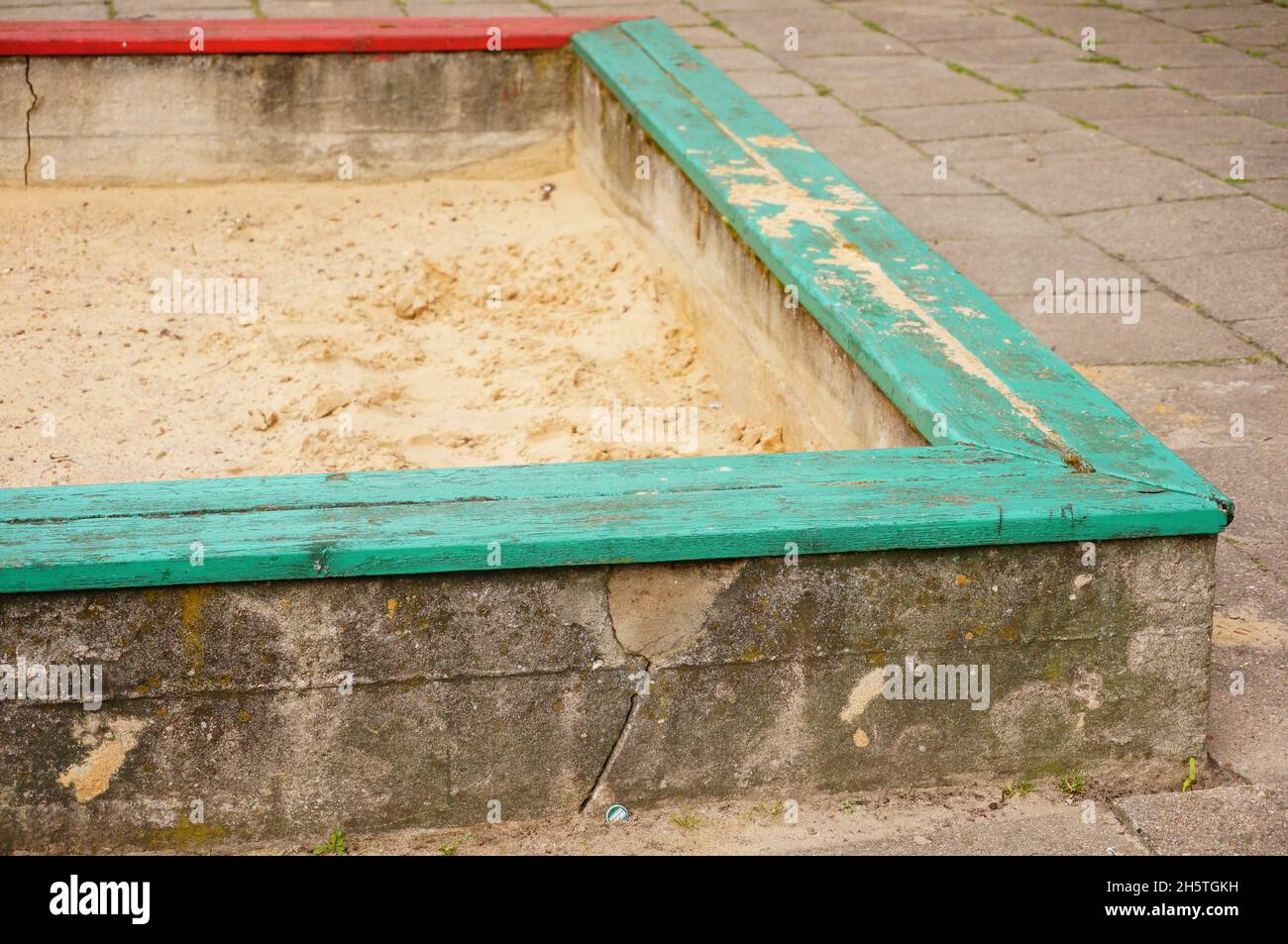 Natural view of a square sandpit in a playground Stock Photo - Alamy