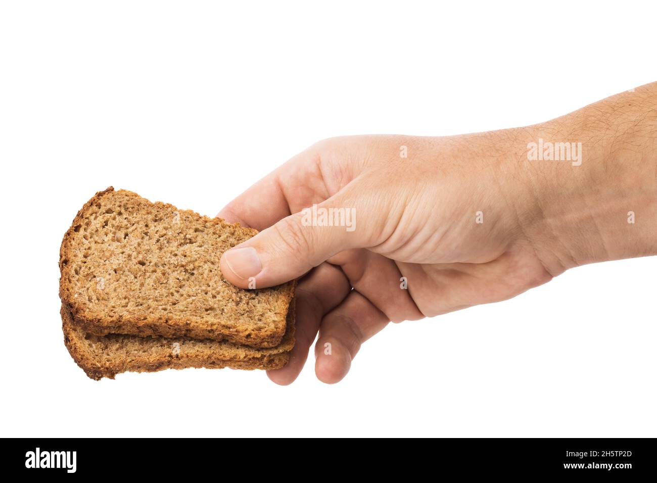Man holds in his hand two pieces of bread isolated on white background ...