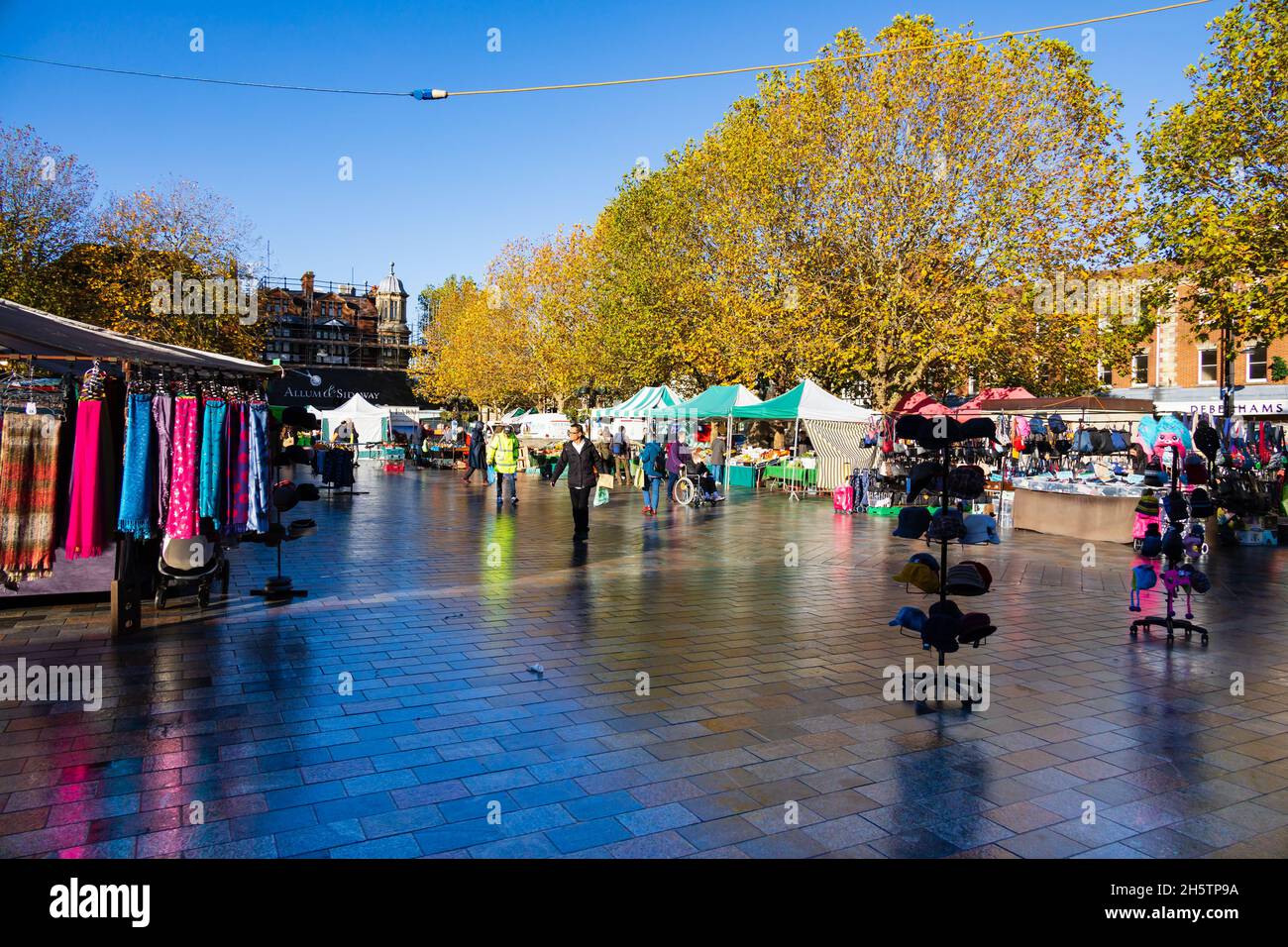 Shoppers on a damp day at Salisbury Market Square. Autumn Stock Photo ...
