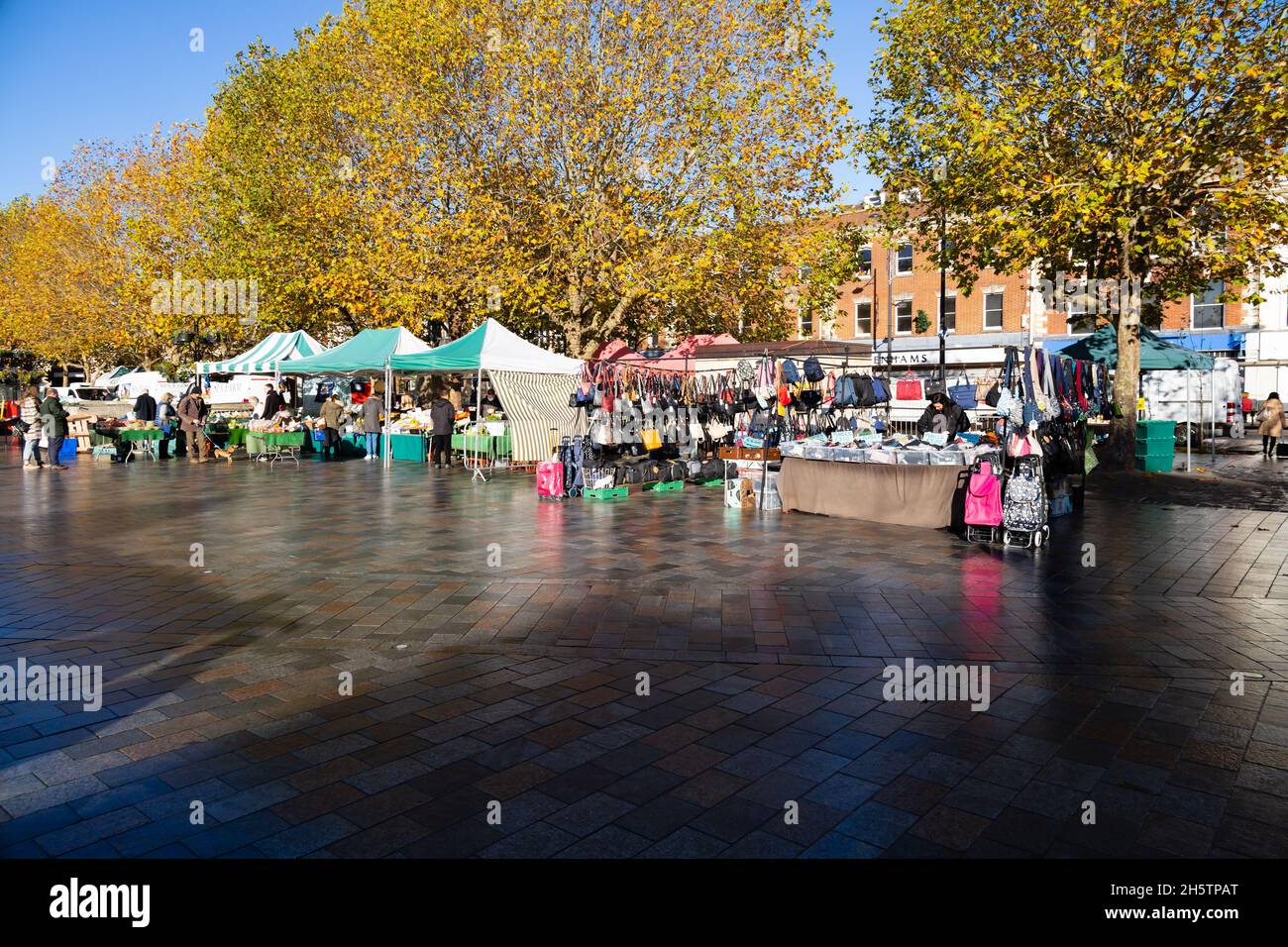 Shoppers on a damp day at Salisbury Market Square. Autumn Stock Photo ...