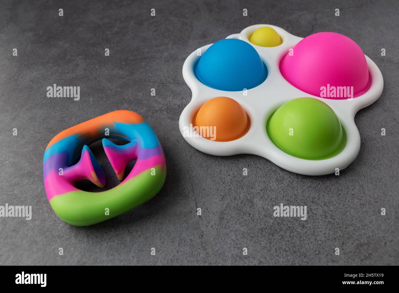 Two fidget toys anti-stress toys Stock Photo - Alamy