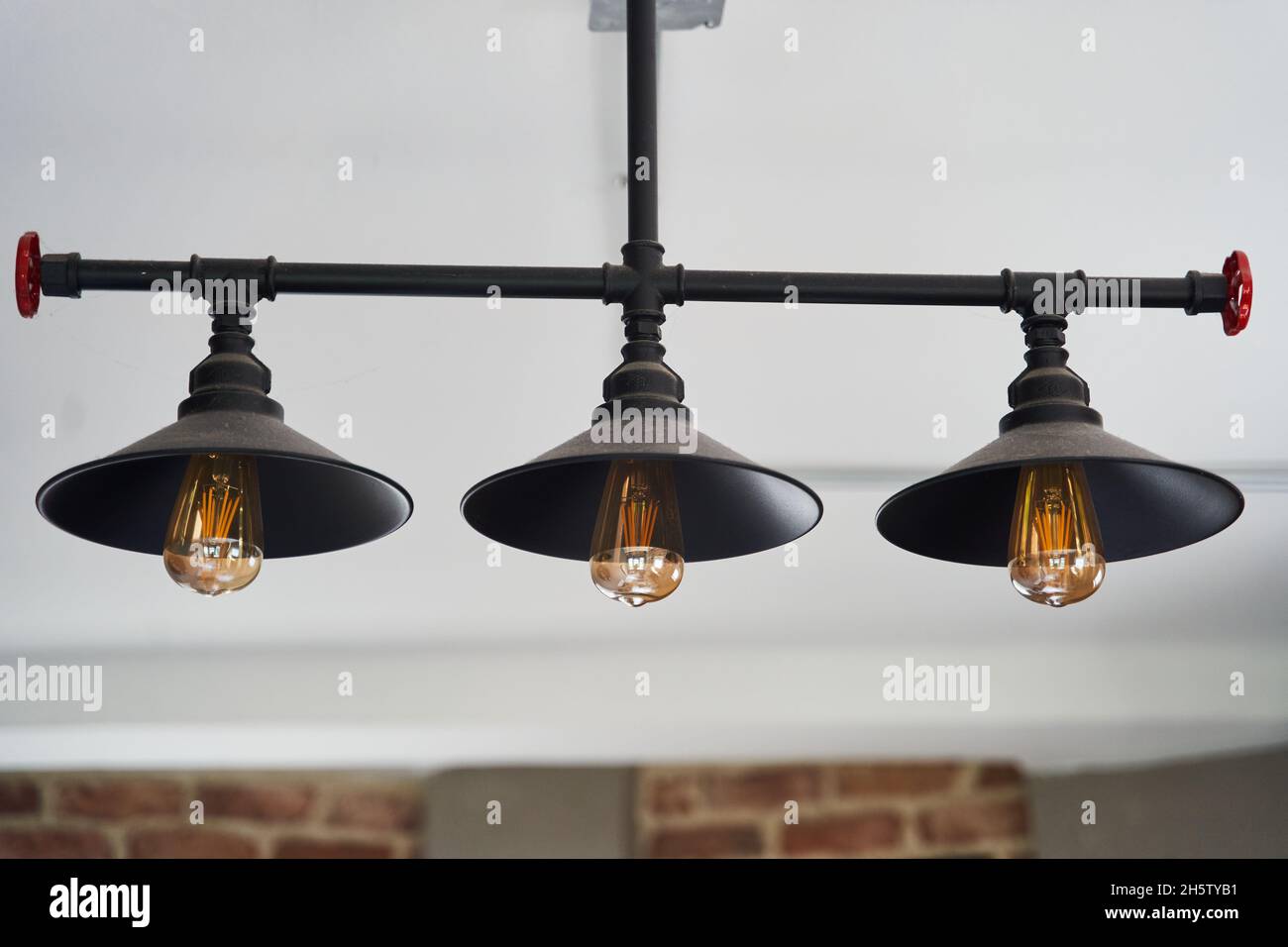 Modern black lamp in the interior of the apartment Stock Photo - Alamy