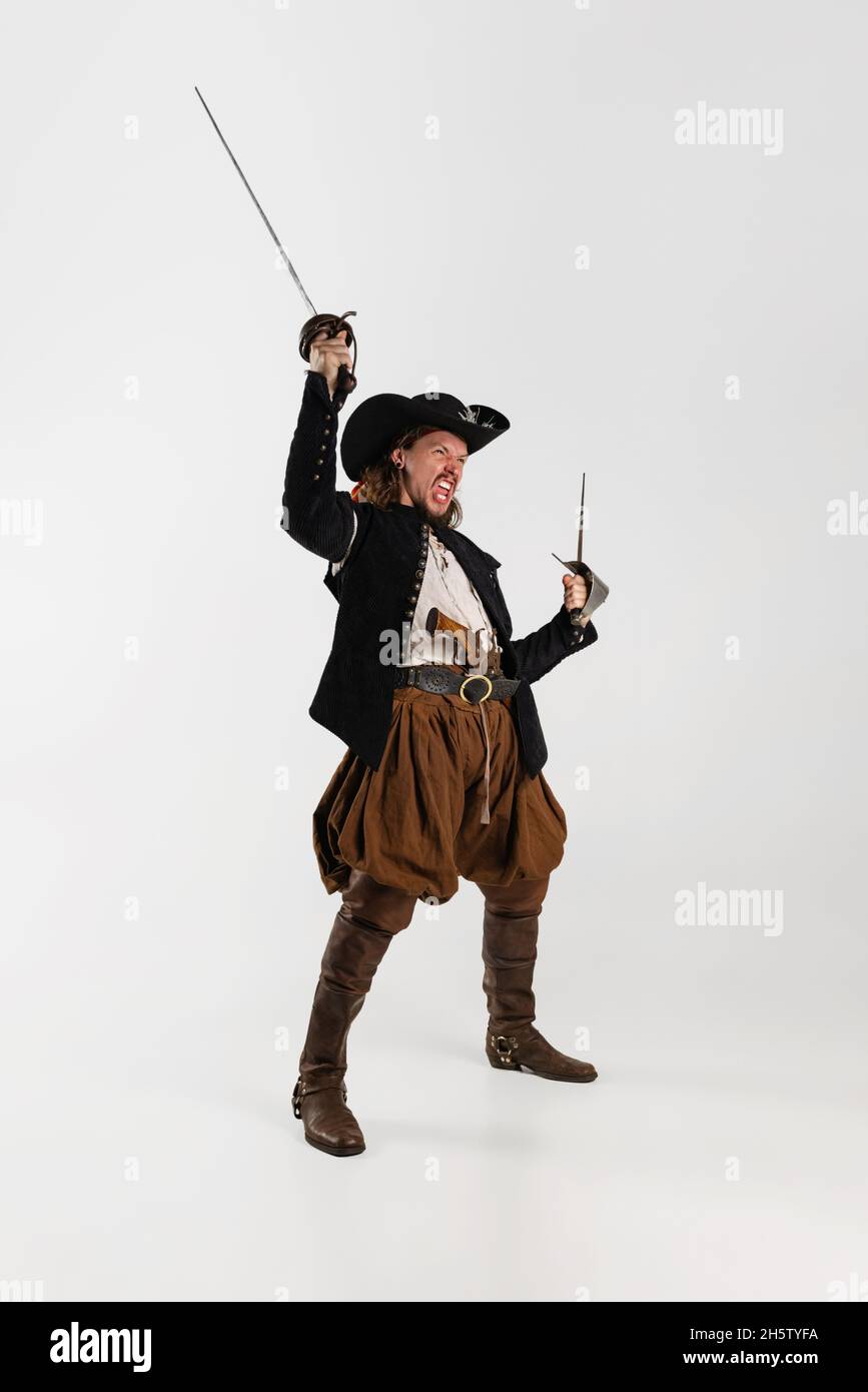 Full-length portrait of brutal, frightening man, pirate in vintage ...