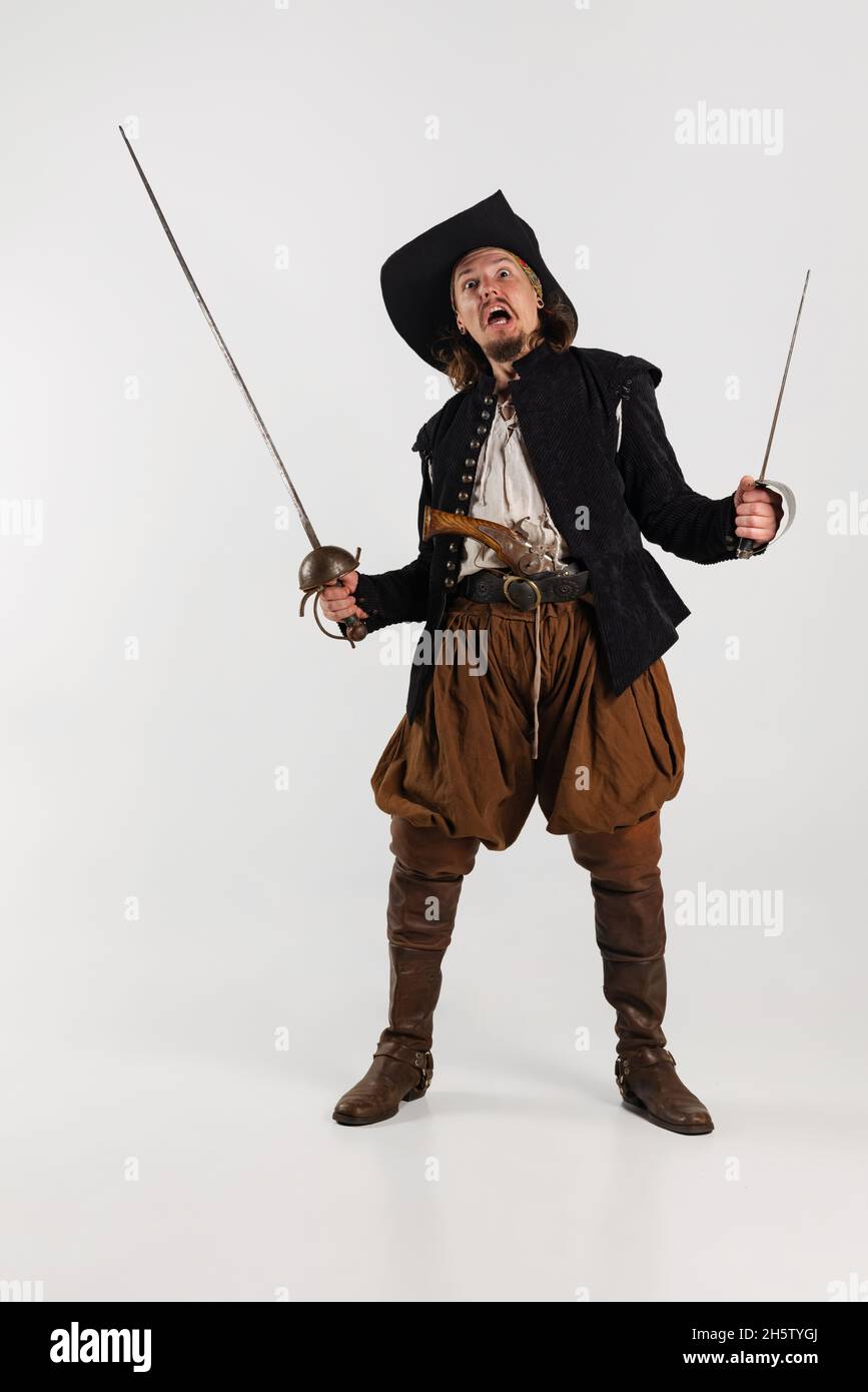 Full-length portrait of brutal, frightening man, pirate in vintage ...