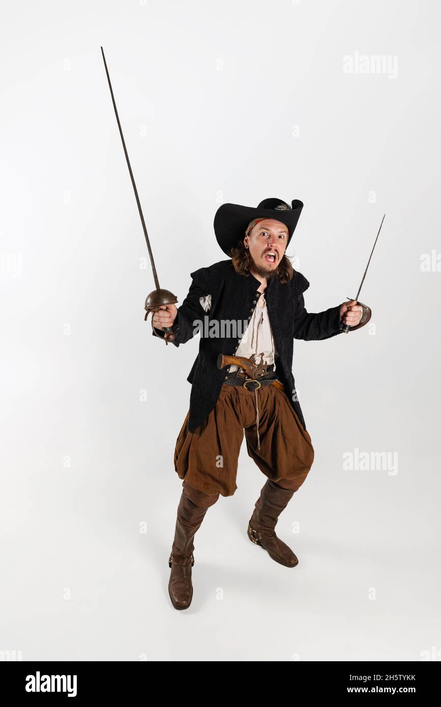 Full-length portrait of brutal, frightening man, pirate in vintage ...