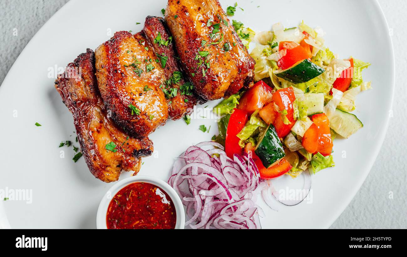 Closeup shot of a delicious meal with meat and salad Stock Photo - Alamy