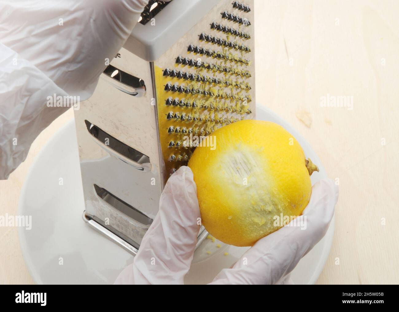 Process of grating lemon for a tile cake Stock Photo - Alamy