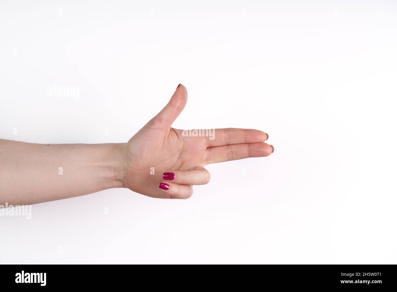 Woman's hand making shooting gun, gesture. hand pistol gesture on ...