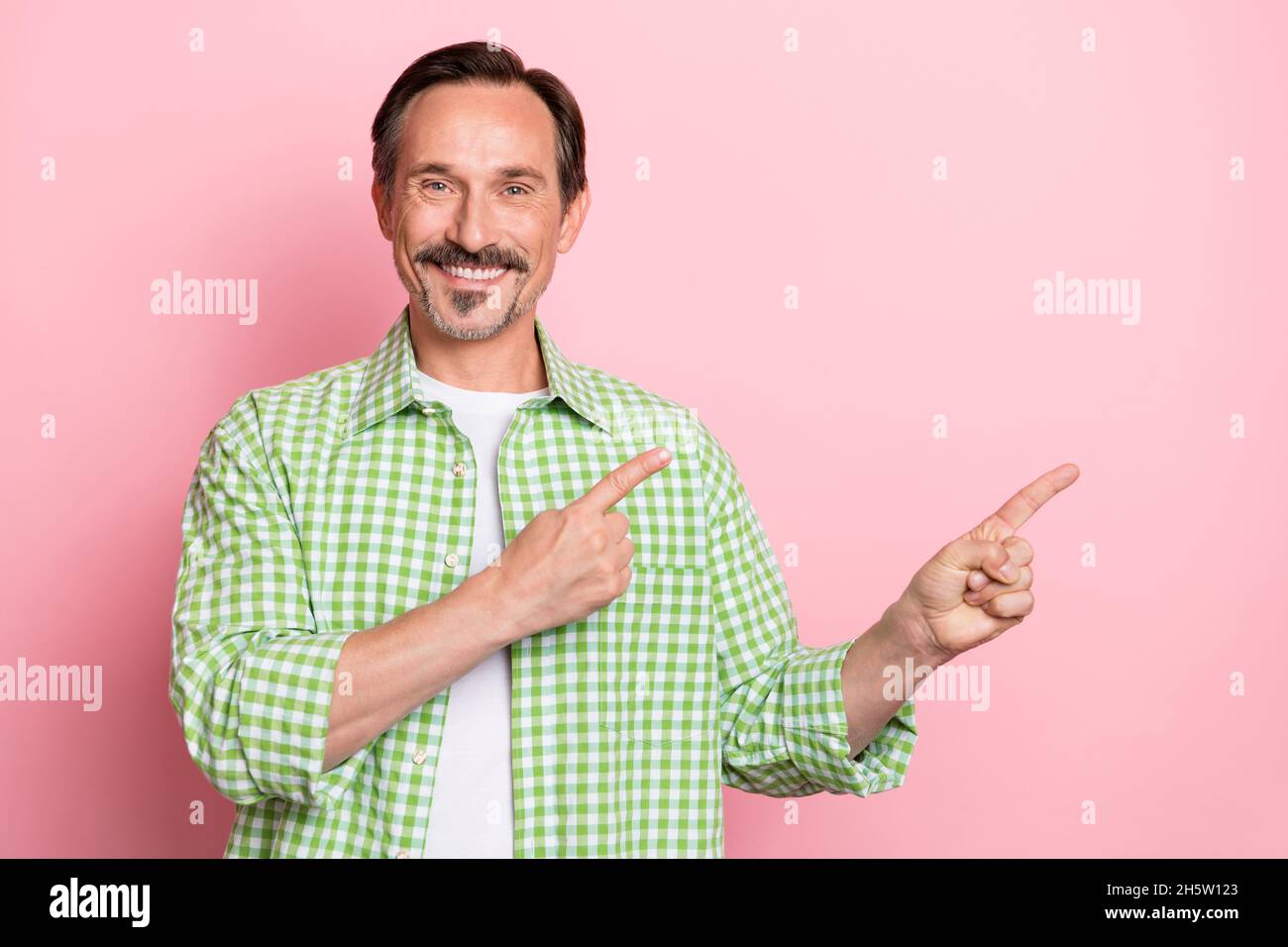 Photo of cute funky young guy dressed green plaid shirt smiling ...