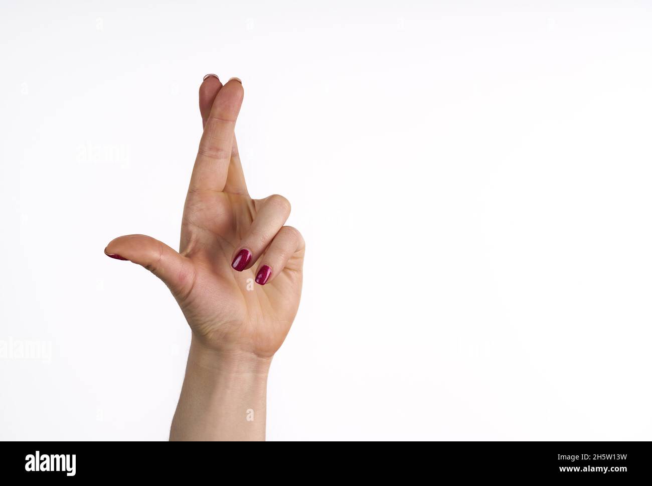 Man hand show finger cross and lie symbol on white background Stock ...
