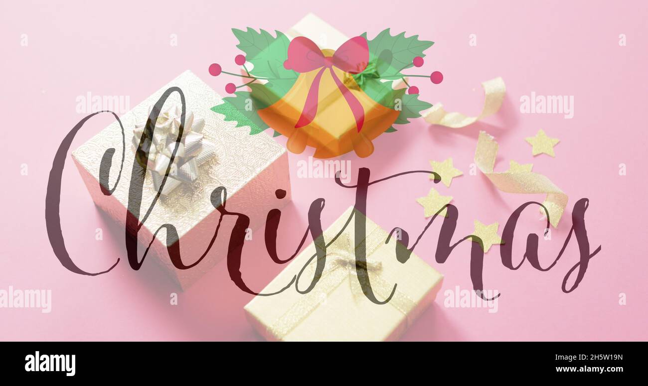 Image of christmas text over christmas gifts Stock Photo - Alamy