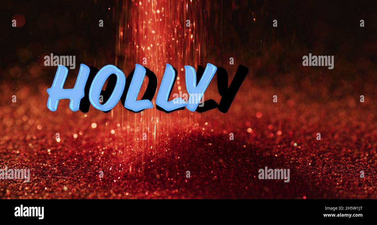 Image of holly text over falling glitter Stock Photo - Alamy