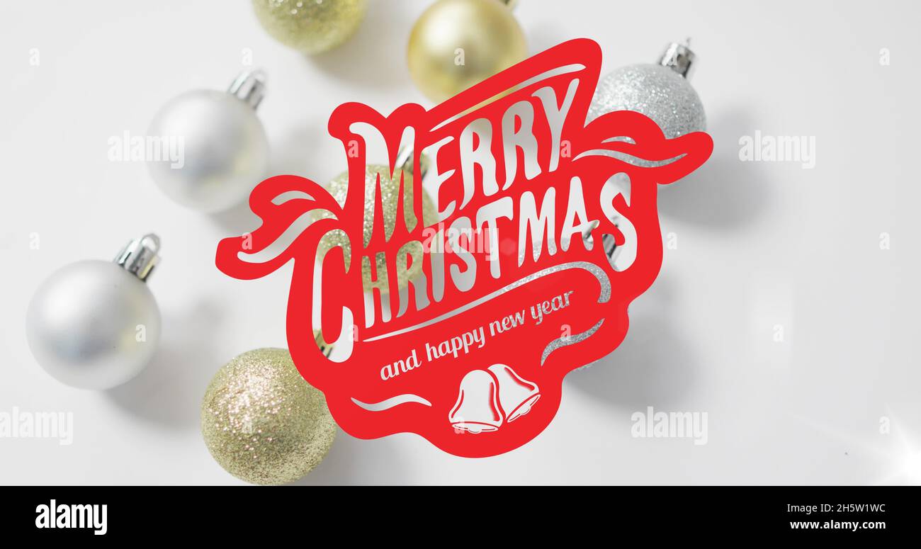 Image of merry christmas text over baubles Stock Photo - Alamy