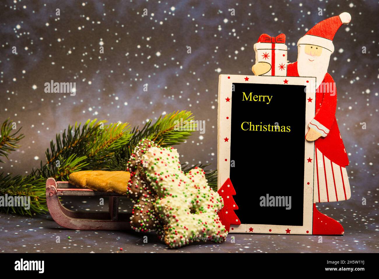 Santa Claus with Merry Christmas blackboard Stock Photo - Alamy