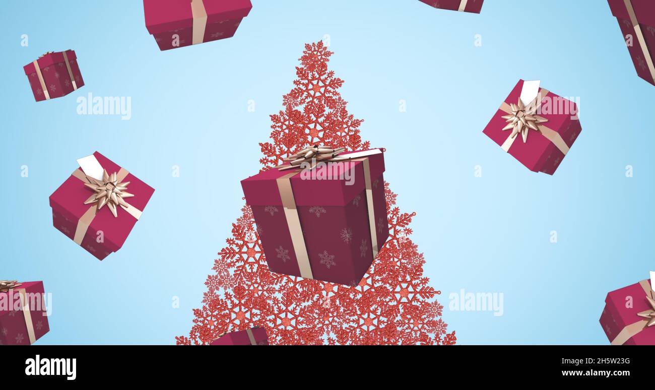 Image of christmas tree over presents falling Stock Photo - Alamy