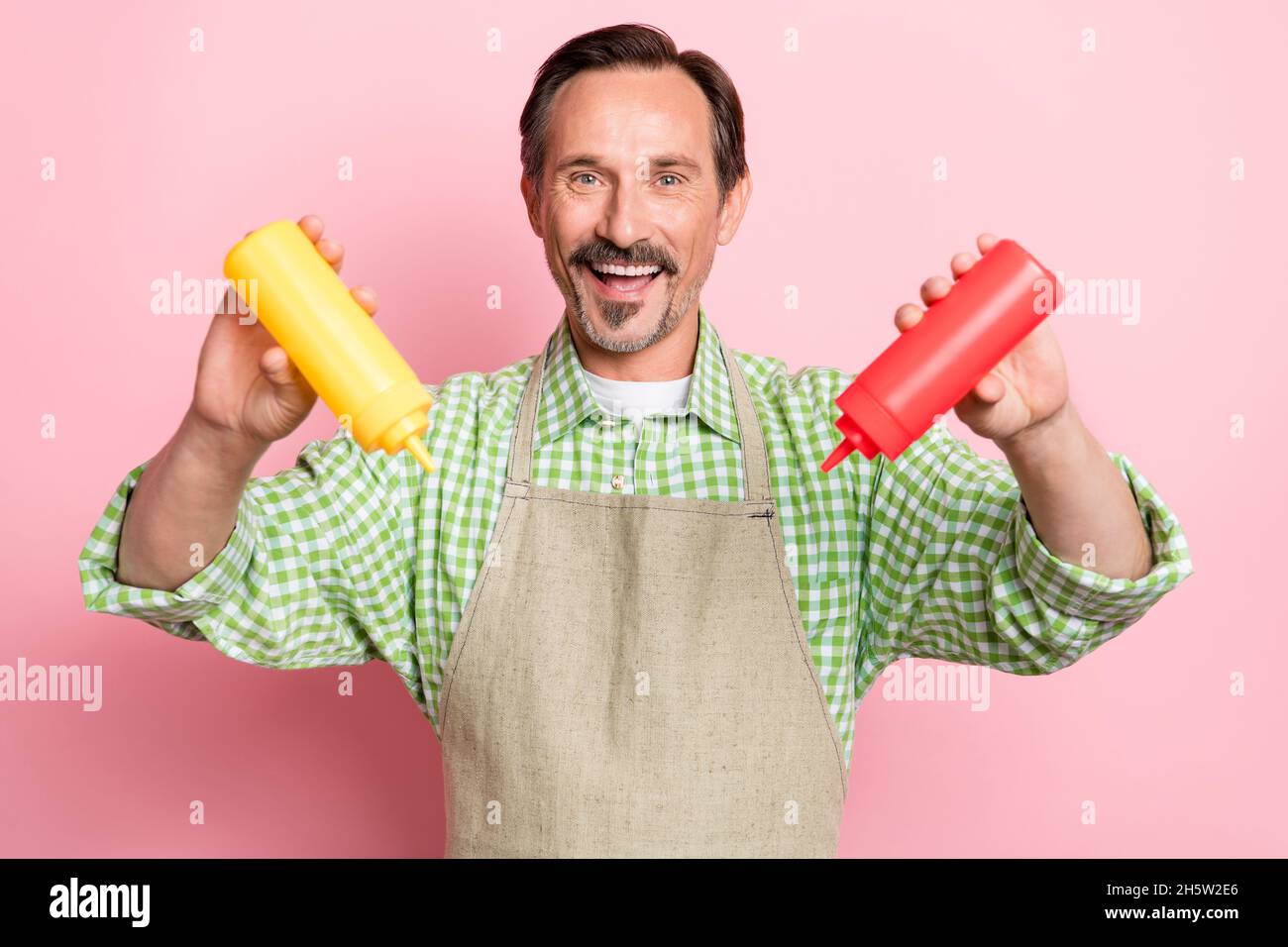 Photo of sweet excited young guy dressed beige apron plaid shirt ...