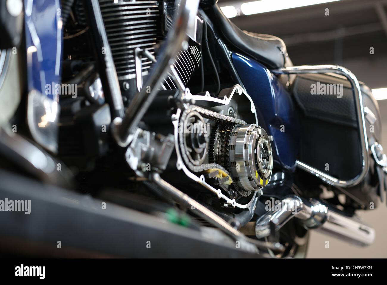 Open chromed motorcycle motor with chain on bench in garage Stock Photo ...