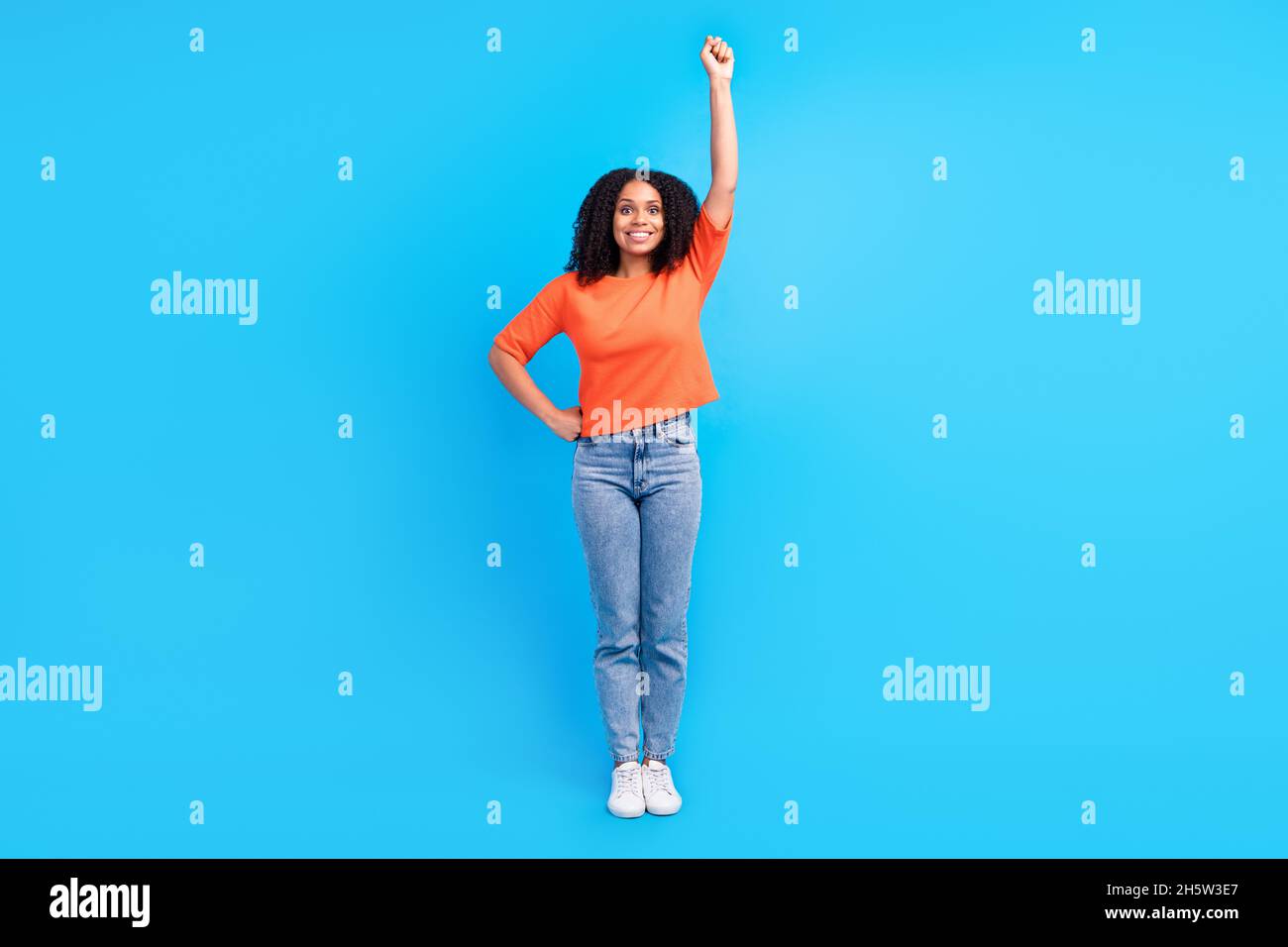 Full length photo of cheerful happy afro american young woman super ...