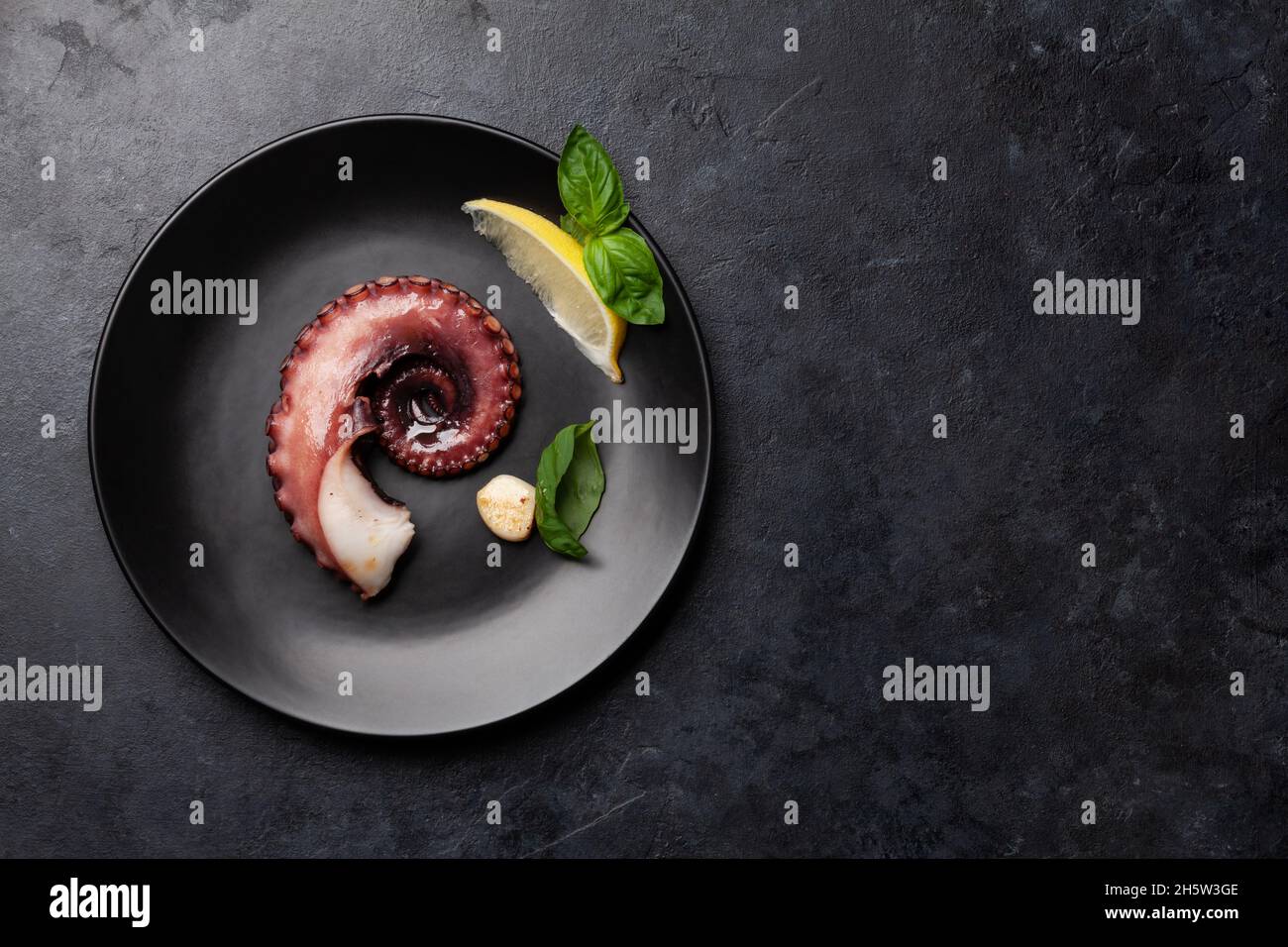 Grilled octopus. Top view flat lay with copy space Stock Photo - Alamy