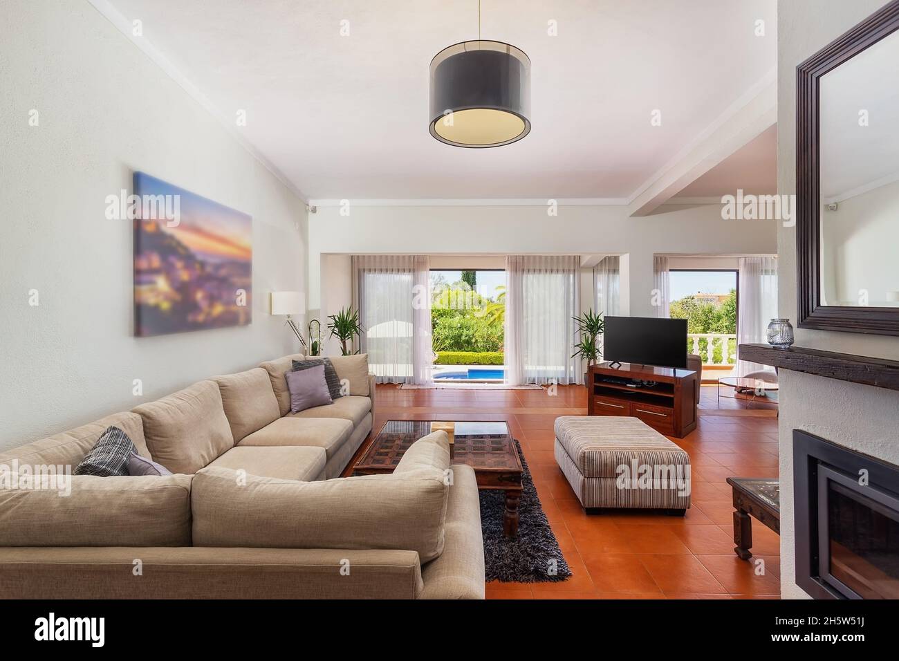 Modern traditional European living room with fireplace and coffee table ...