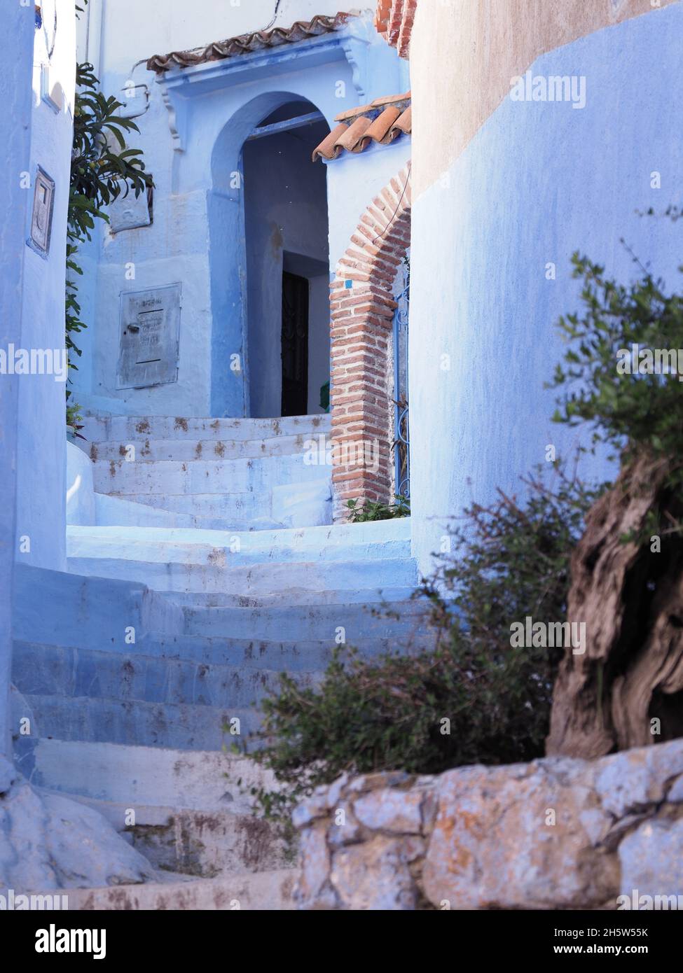 Blue stairs and door at moroccan alley in african Chefchaouen city in ...