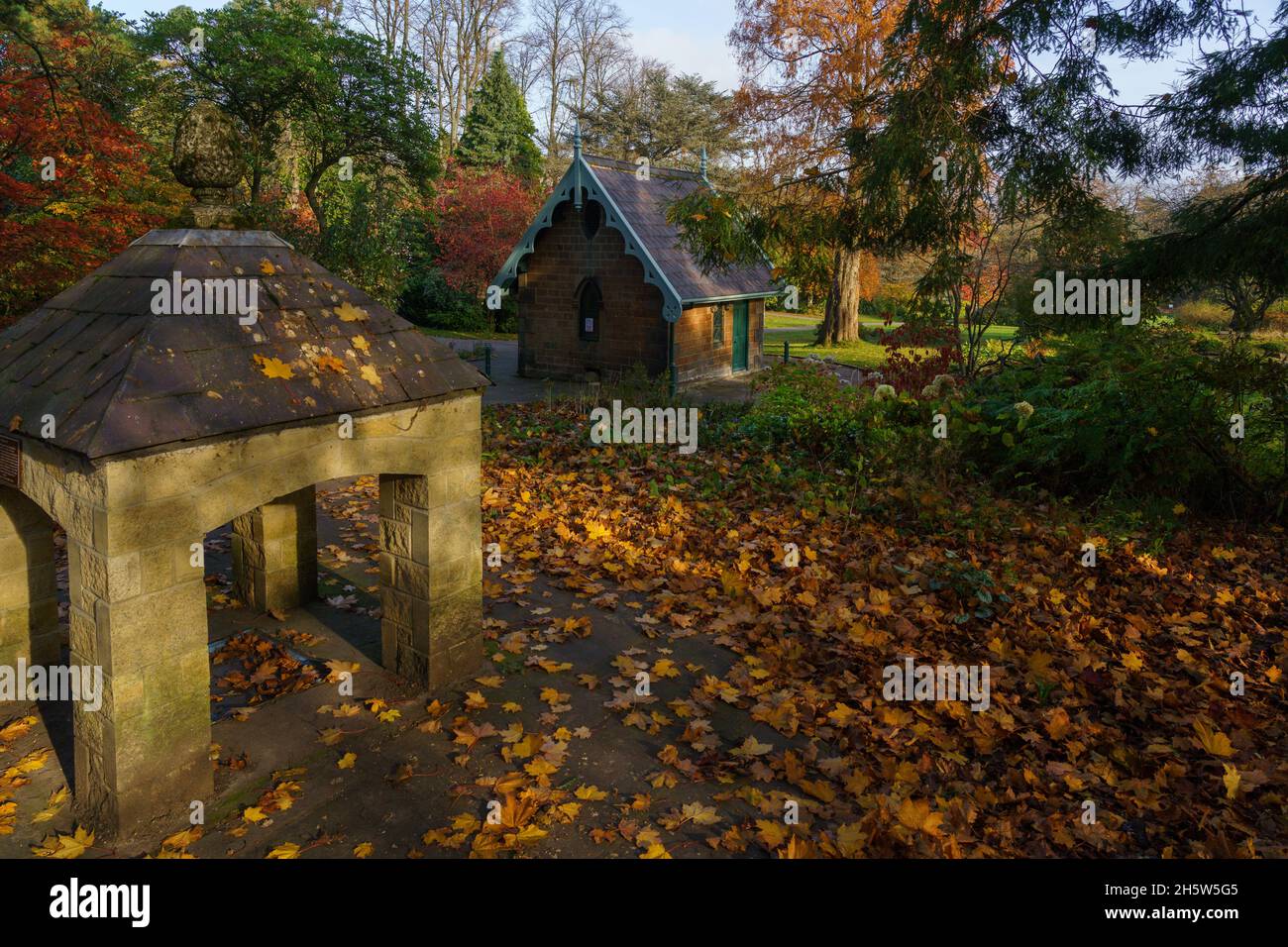 Leaves of autumn falling close to a renovated pumping room adjacent to ...