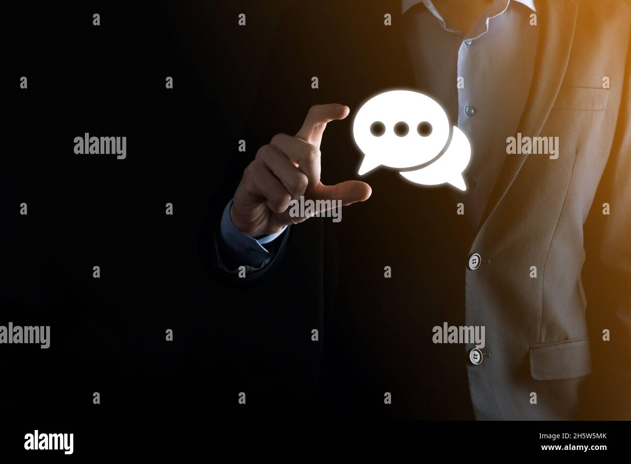 Businessman holding a message icon, bubble talk notification sign in ...