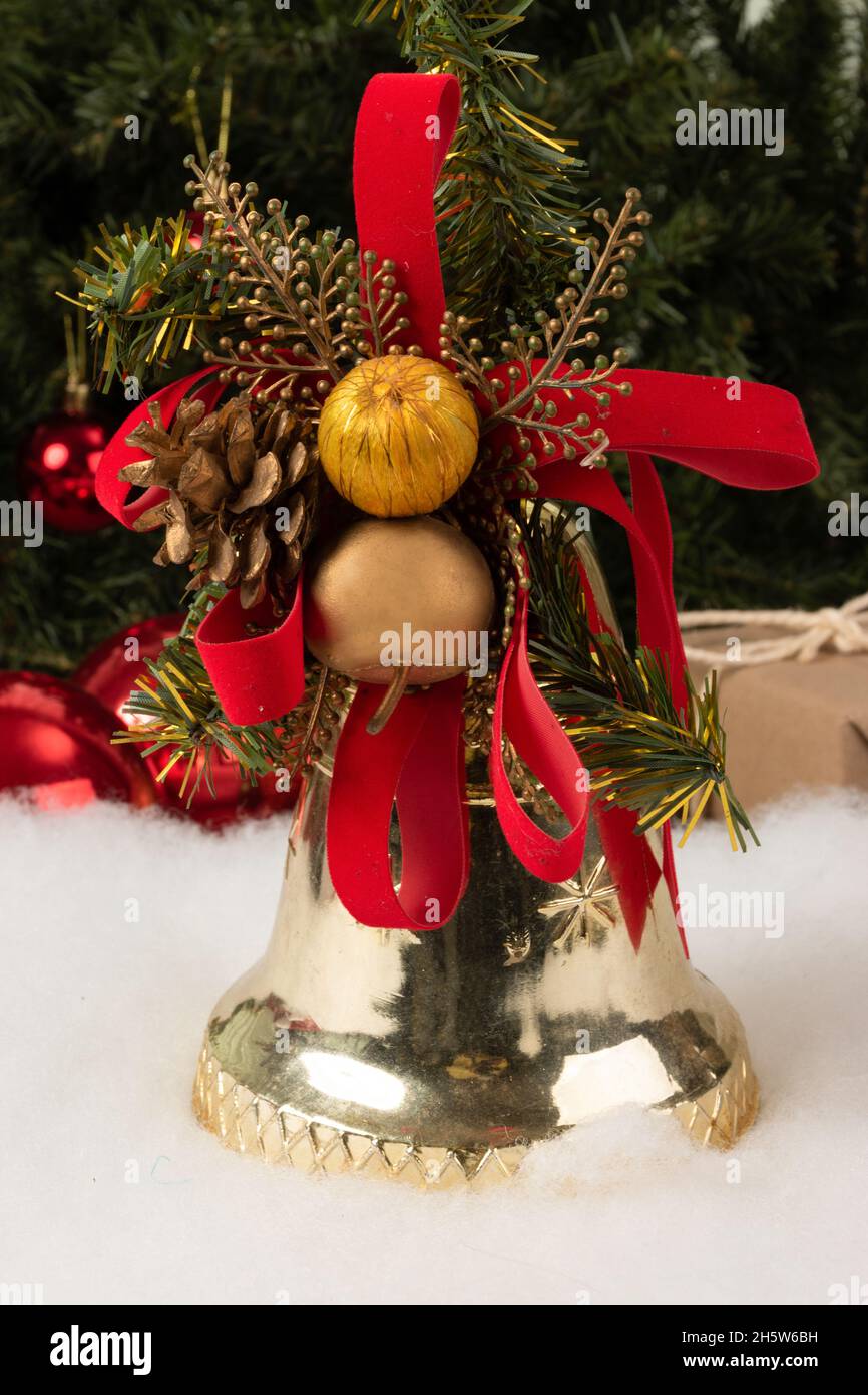 beautiful golden bell decorated with an arrangement with spheres, bows ...