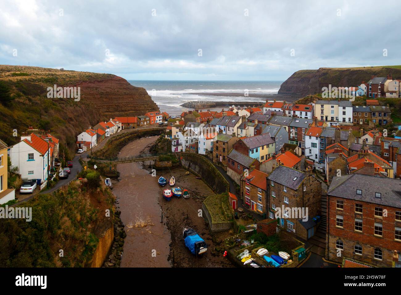 View looking seawards over the harbour of the North Yorkshire Village ...
