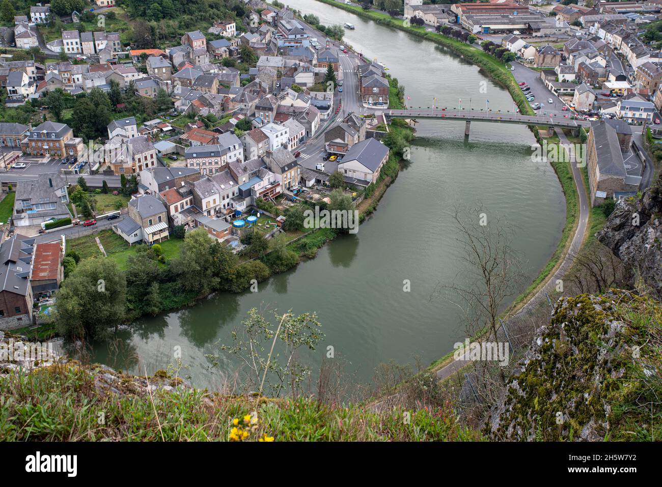 Aerial view of a town in the Ardennes crossed by the Meuse River in ...