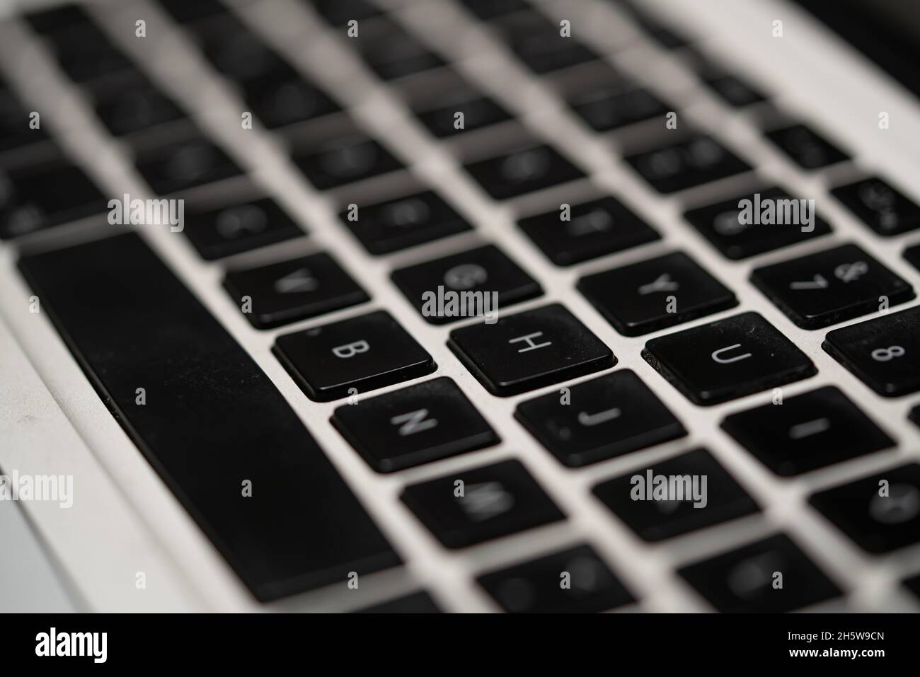 photo of a black qwerty keyboard on a silver background Stock Photo - Alamy