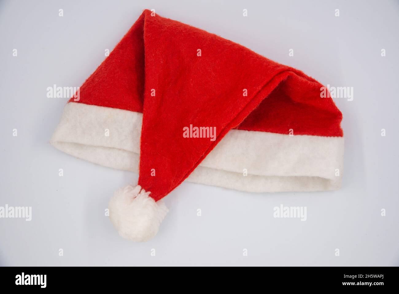 Santa Claus red hat isolated on white background Stock Photo - Alamy