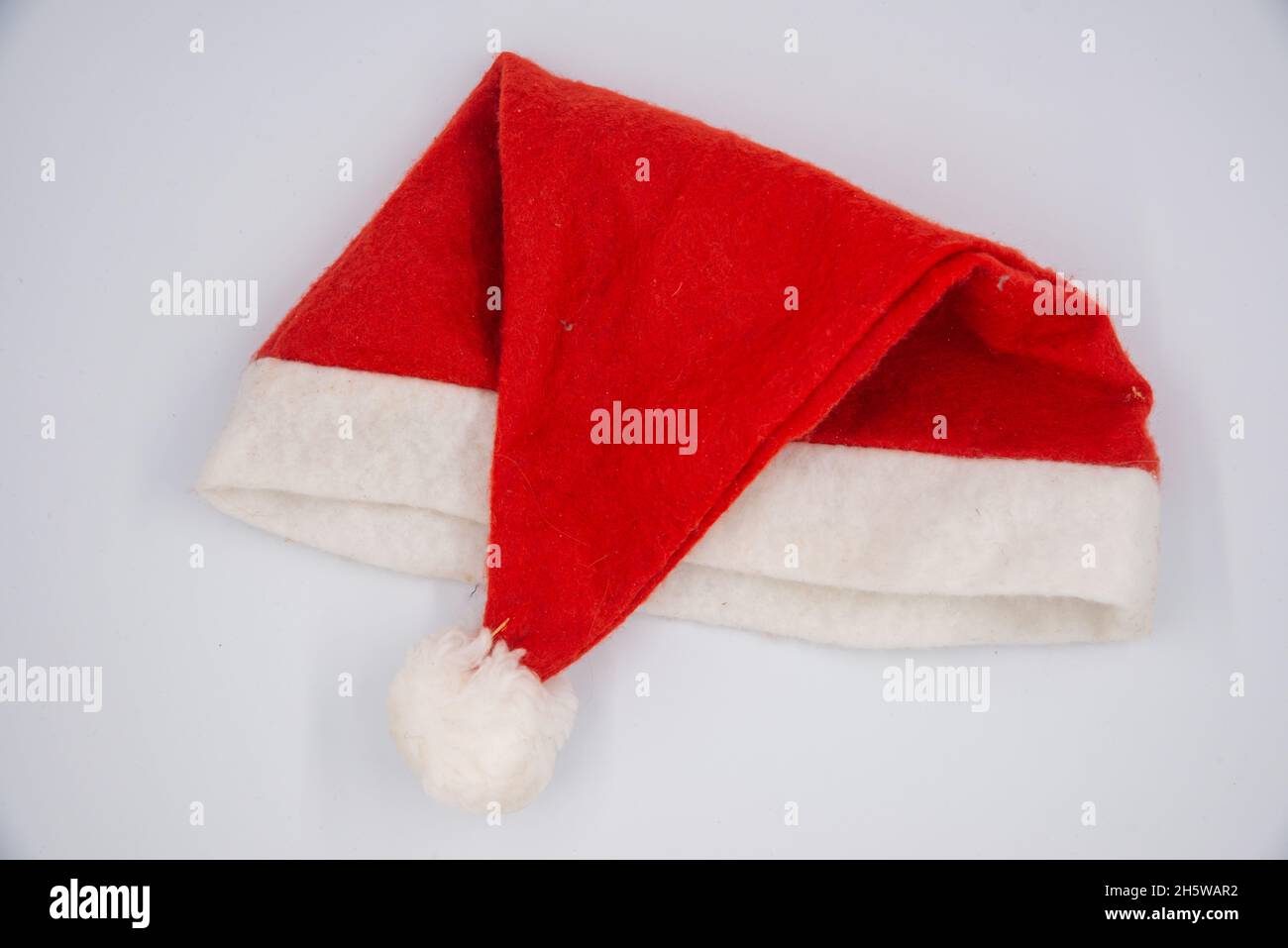 Santa Claus red hat isolated on white background Stock Photo - Alamy