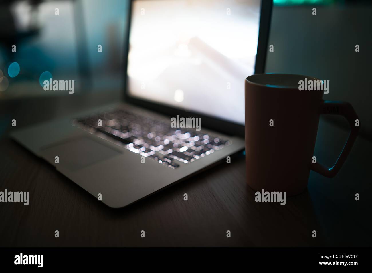 Close up of laptop keyboard colorful neon illumination, backlit ...