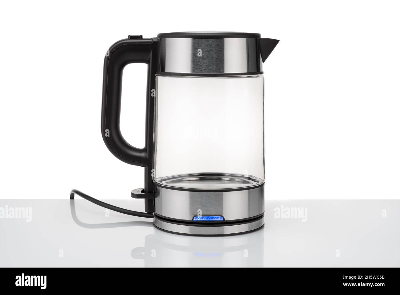 Glass, electric, modern transparent kettle on a white background. On ...