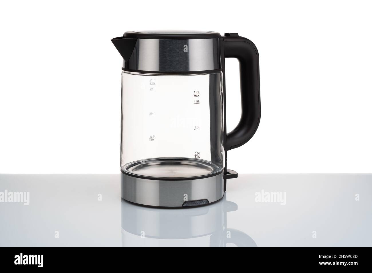 Glass, electric, modern transparent kettle on a white background. Close ...