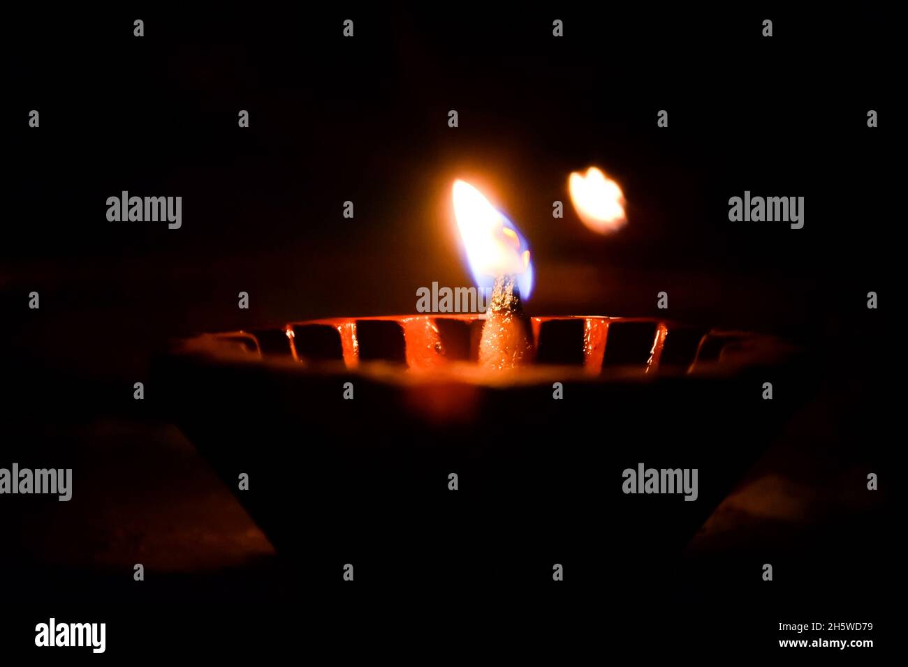 Close up of Diwali diya which is a oil lamp lightened during festival ...
