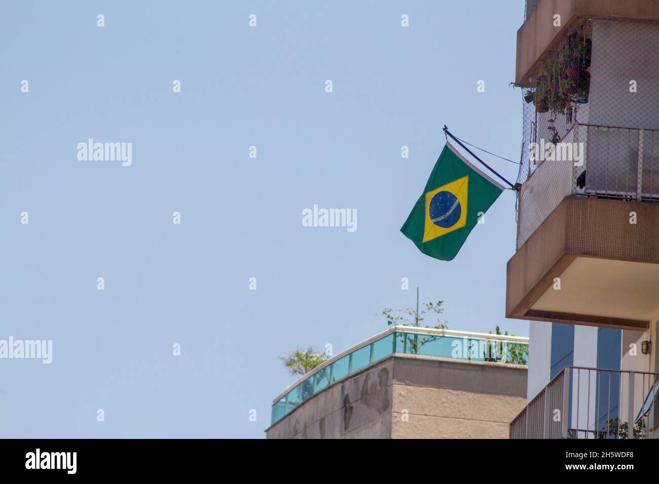 Brazil flag on the window of a building in Rio de Janeiro Stock Photo ...