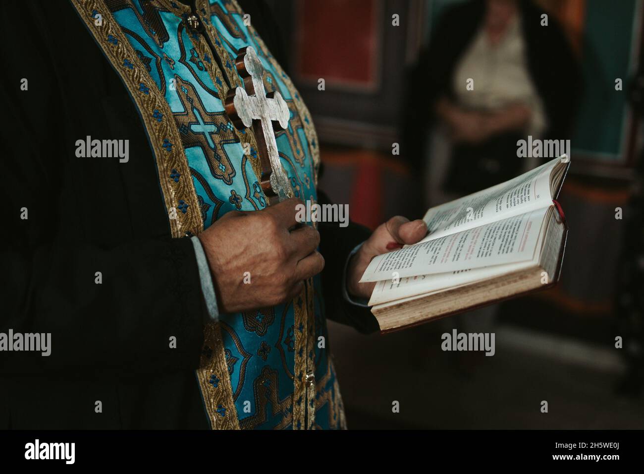 Closeup of a priest reading bible in a church Stock Photo - Alamy