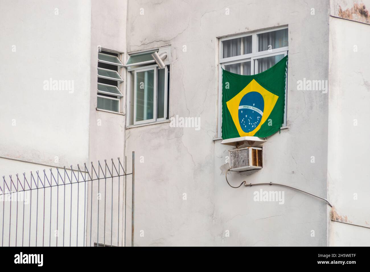 Brazil flag on the window of a building in Rio de Janeiro Stock Photo ...
