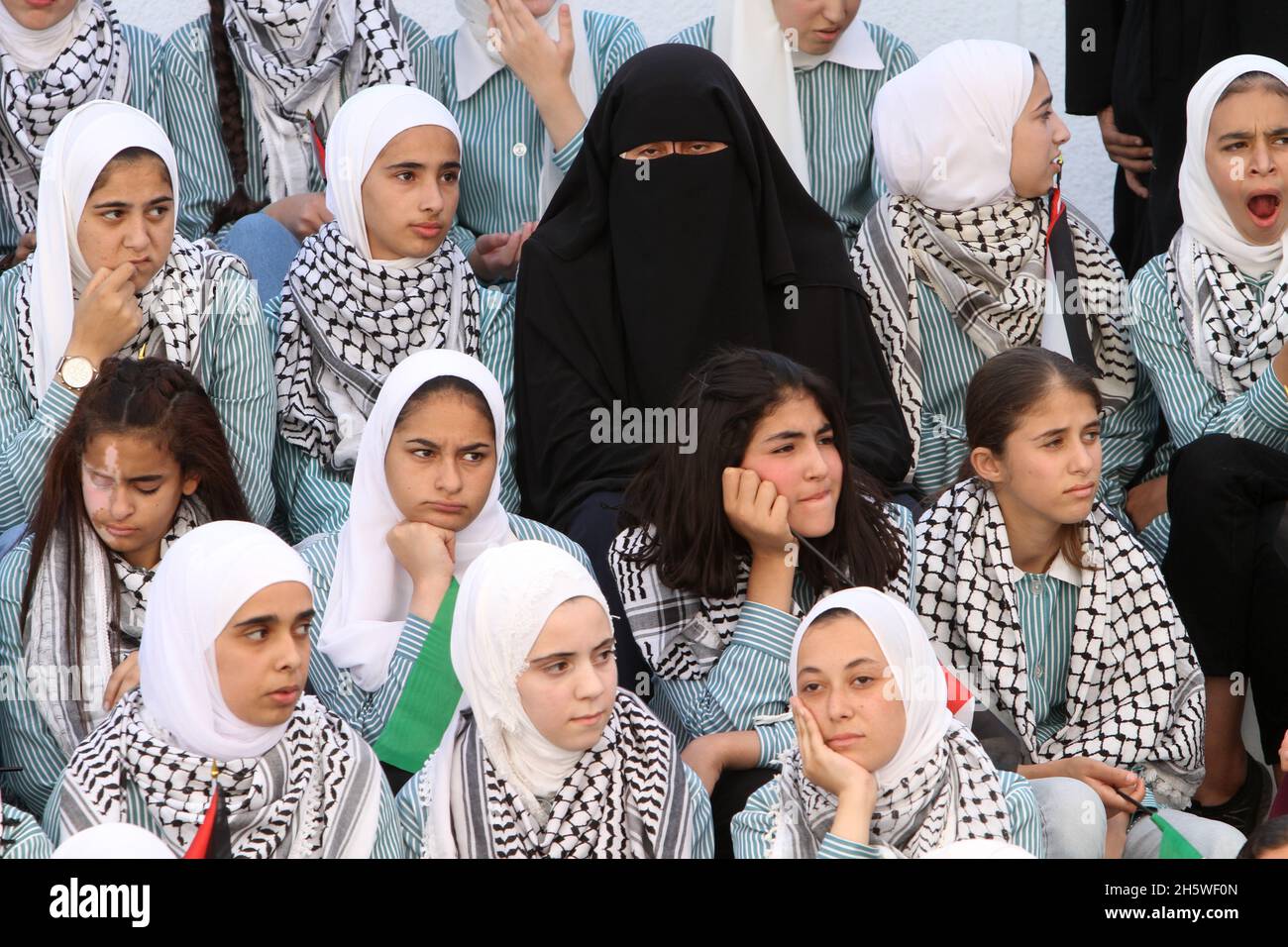 Palestinian students attend the seventeenth anniversary of the death of the late Palestinian ...