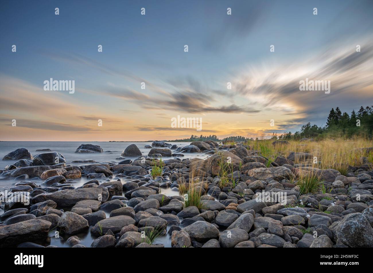 Long Exposure of Magnificent Soft and colorful sunset by the seaside ...